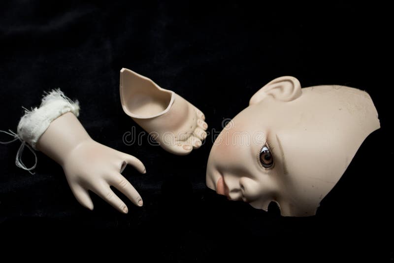 Broken Doll Parts on Black Background Stock Photo - Image of body, face ...