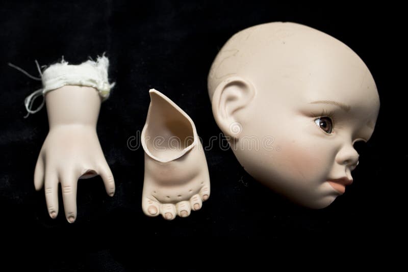 Broken Doll Parts on Black Background Stock Photo - Image of feet ...