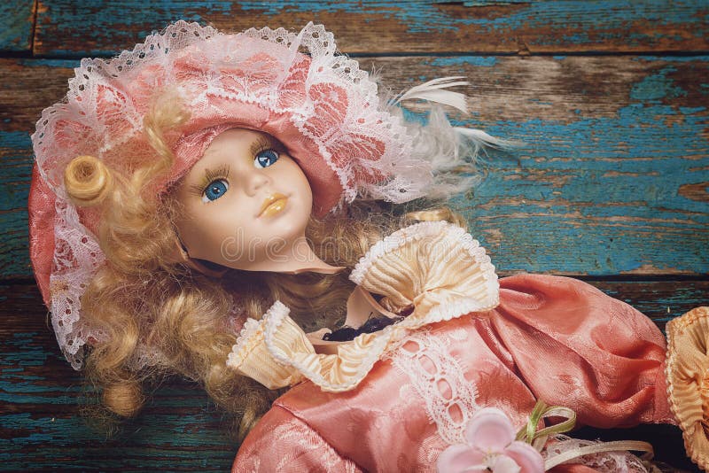 Broken Doll on a Wooden Floor. Stock Image - Image of abuse, doll: 72354415