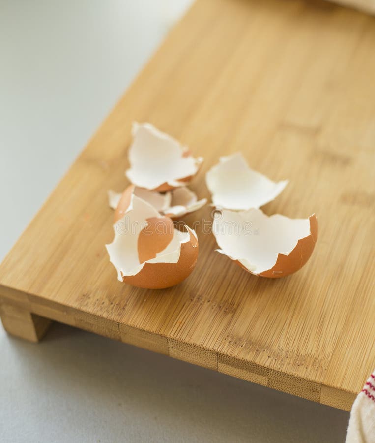Broken Egg Shell on Wooden Cutting Board Stock Image - Image of diet ...