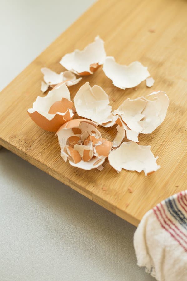 Broken Egg Shell on Wooden Cutting Board Stock Image - Image of brown ...