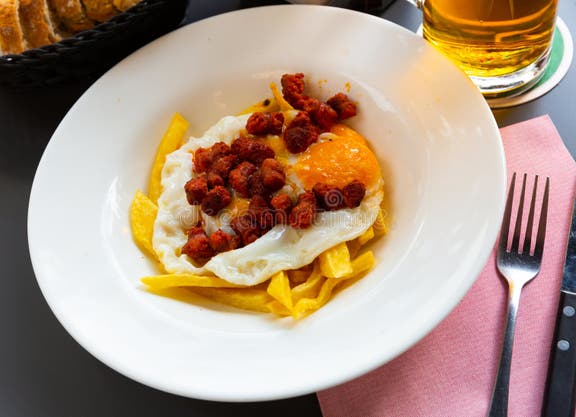 Broken eggs with chistorra stock image. Image of roasted - 283458393