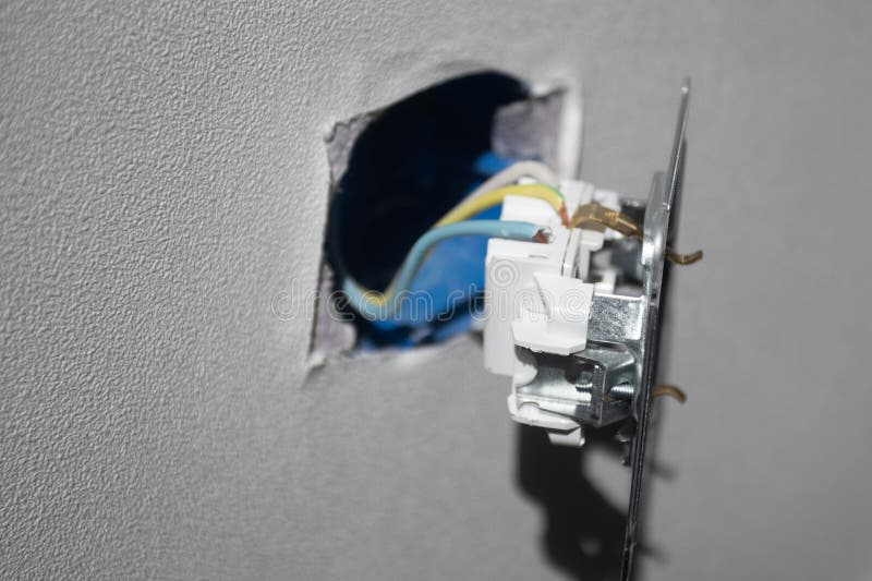 Broken Electric Socket Torn from White Wall Stock Photo - Image of ...