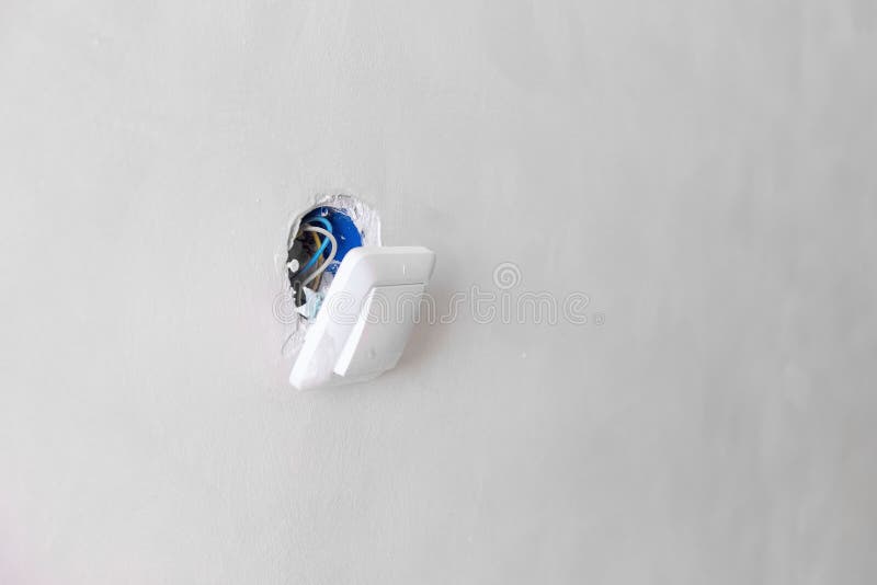 A Broken Electric Switch on a White Wall Stock Photo - Image of retro ...