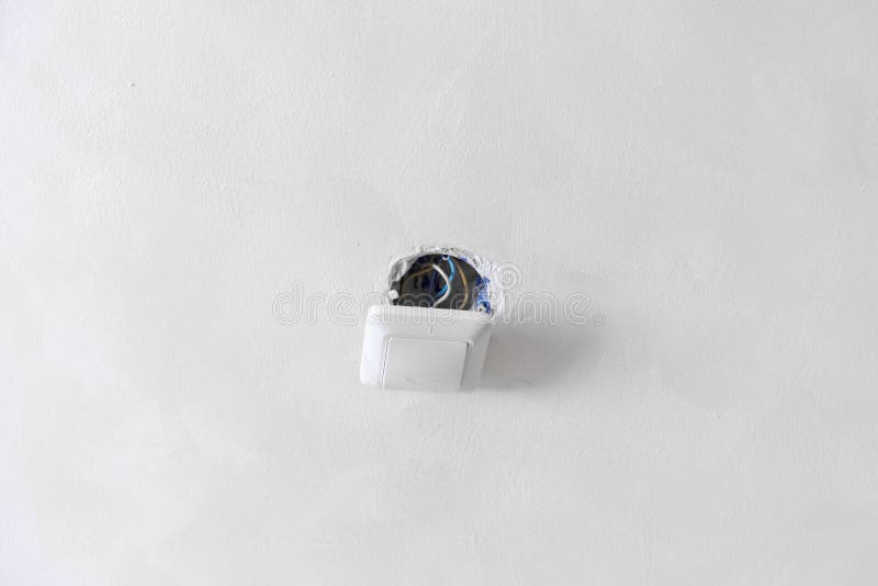 A Broken Electric Switch on a White Wall Stock Image - Image of dirty ...