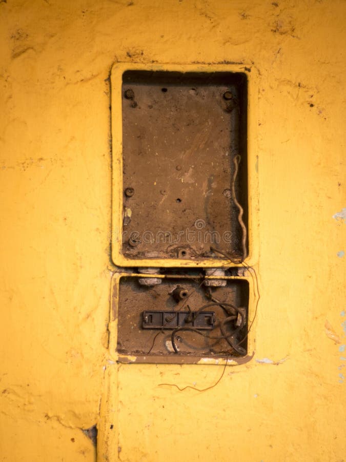 Broken Electrical Box on Yellow Wall Stock Image - Image of rusty ...