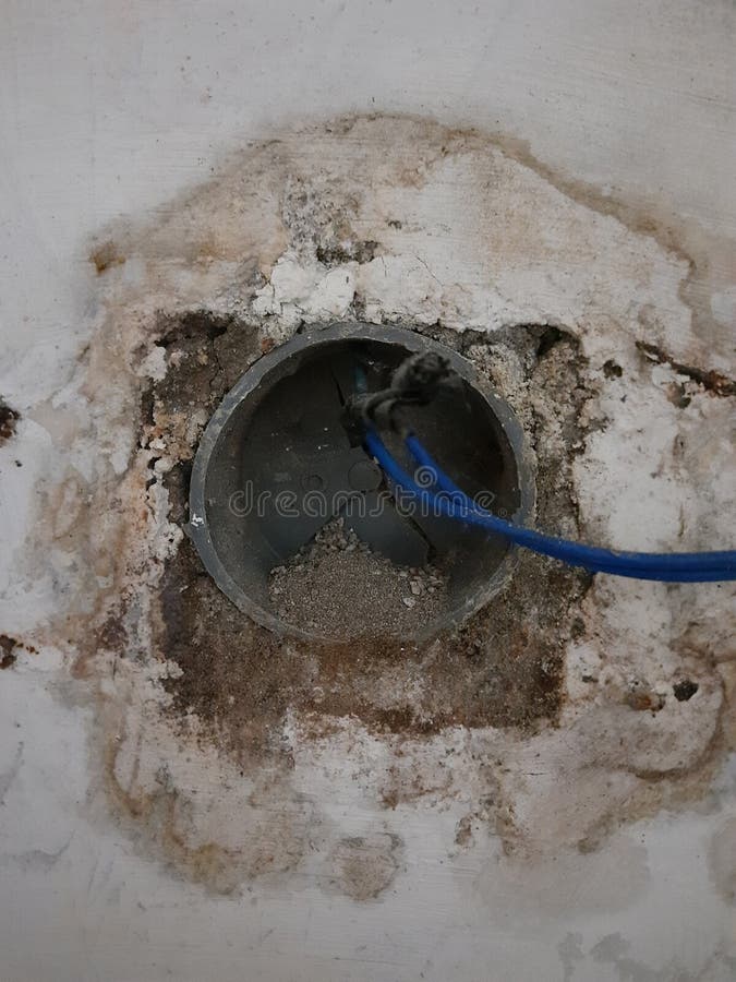 A Broken Electrical Outlet in the Wall of the House Stock Image - Image ...