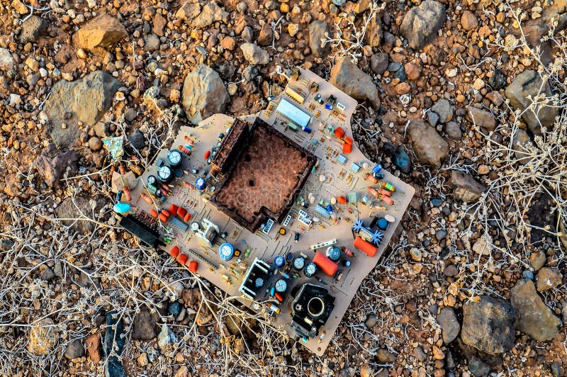 A Broken Electronic Device is Laying on the Ground in a Rocky Area ...