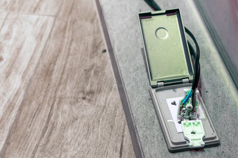 The Broken Electronic Plug in Power Socket on the Floor Still in Use ...