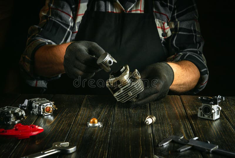 Broken Engine in the Hands of a Master. Repair of Engines from a Petrol ...