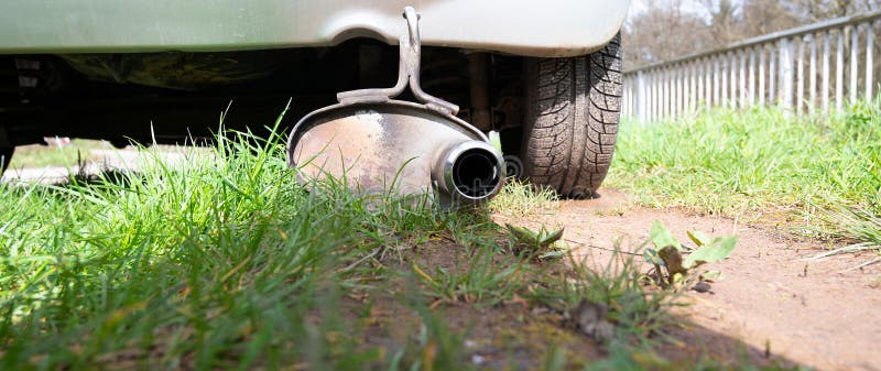 Broken Exhaust and Muffler of a Car, Rusted Silencer Fallen Down on the ...