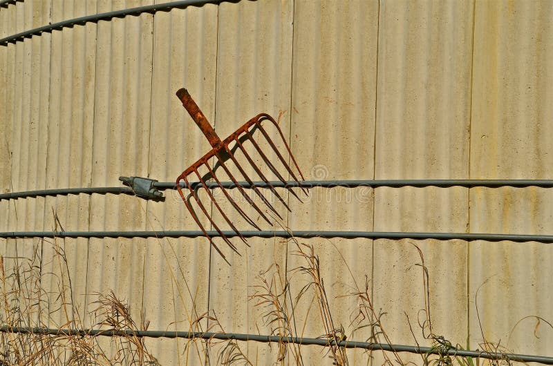 Broken Fork Hanging on an Old Silo Stock Photo - Image of potato, fork ...