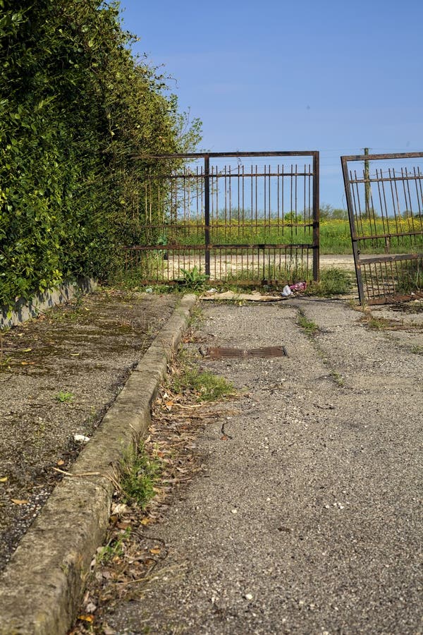Broken Gate at the End of a Road on a Sunny Day in the Italian ...