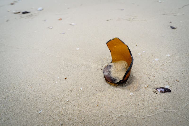 Broken Glass Bottle on Sand. Stock Photo - Image of bottle, pieces ...