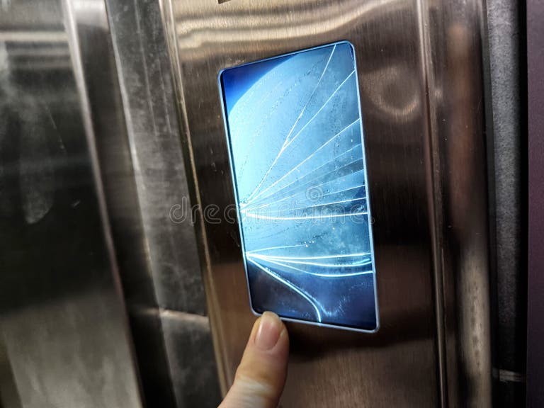 Broken Glass on an Elevator Panel Reveals Widespread Cracks and Damage ...