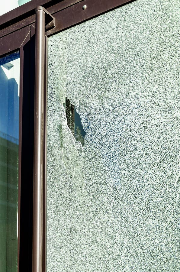 Broken Glass. Hole in the Tempered Glass of Front Door Stock Photo ...