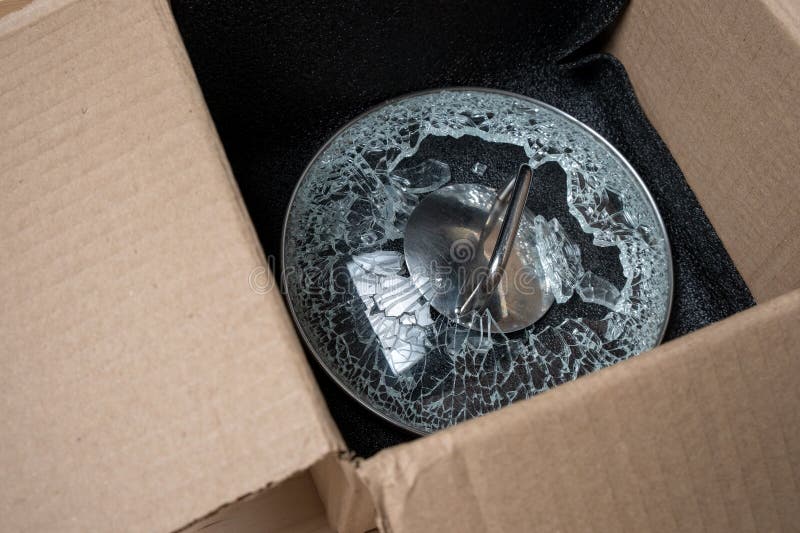 Broken Glass Lid in an Open Cardboard Box with Bubble Wrap Stock Image ...
