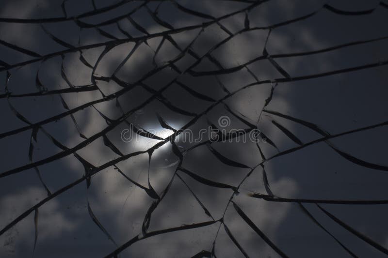 Broken Glass Over Sky and Sun Behind the Cloud Background. Stock ...