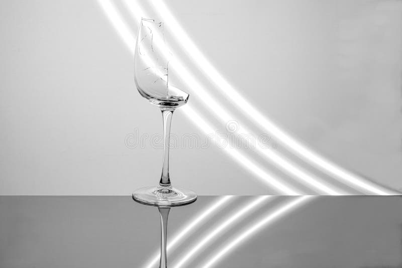 Broken Glass in the Rays of Light and Reflection on a Glass Table Stock ...