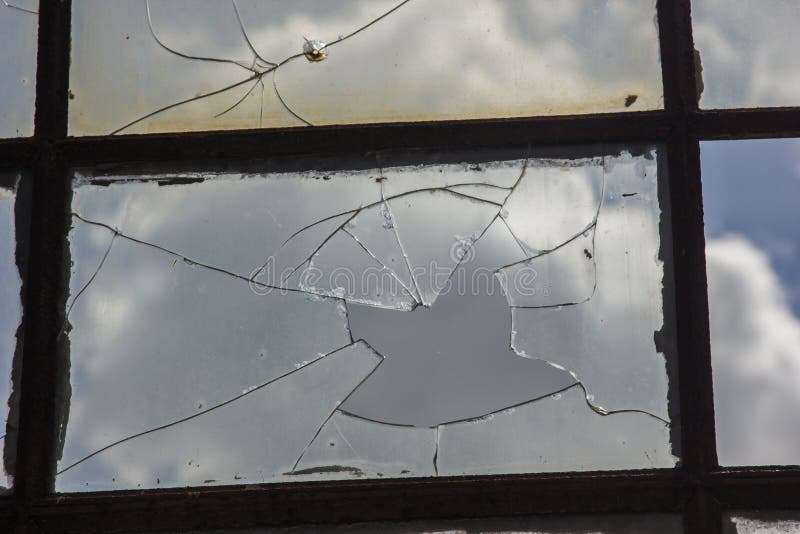 Broken glass in the window stock photo. Image of macro - 222144954