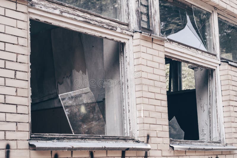 Broken Glass in Windows of Old, Abandoned Building with Tiles Stock ...