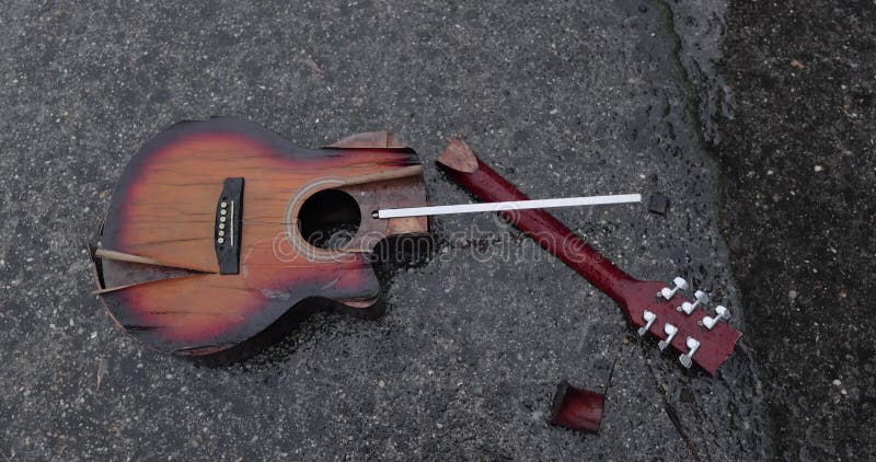 Broken Guitar in Snowy Rain Stock Video - Video of abandoned, discarded ...
