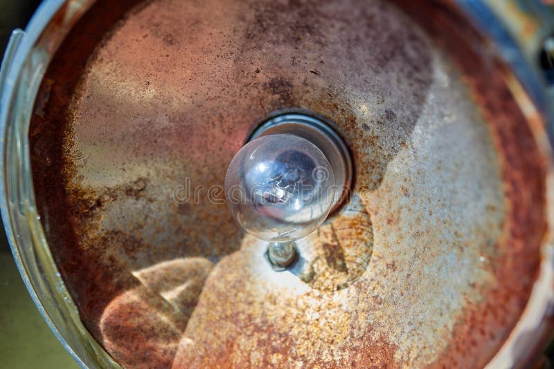 Broken Headlight of an Old Rusty Car, There is a Light Bulb. Stock ...