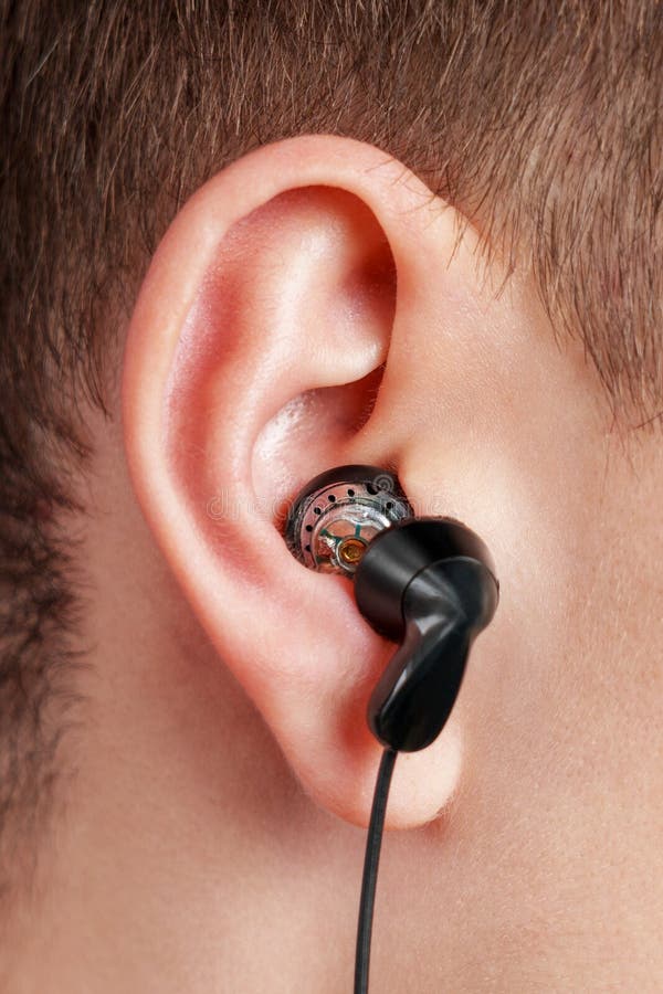 A Broken Headphone in the Ear of a Young Man in Close-up Stock Image ...