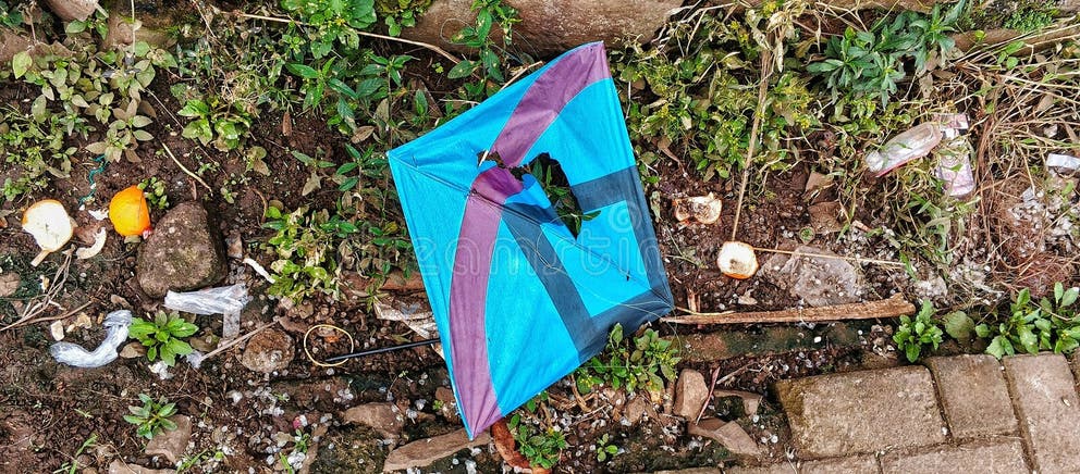 A Broken Kite Lying on the Ground Becomes Trash Stock Image - Image of ...