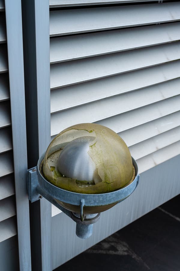 Broken lamp on a wall.. stock photo. Image of house - 294606934