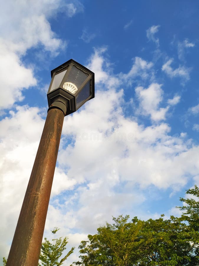 Broken lamppost at park stock image. Image of spire - 219976687