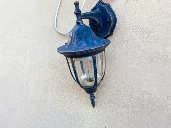 Broken Lantern Mounted on the Wall by the Door Stock Image - Image of ...