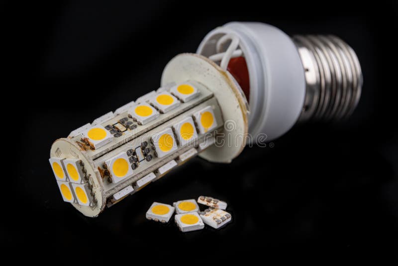 Broken Led Bulb on a Dark Table. Modern Lighting Under Repair Stock ...