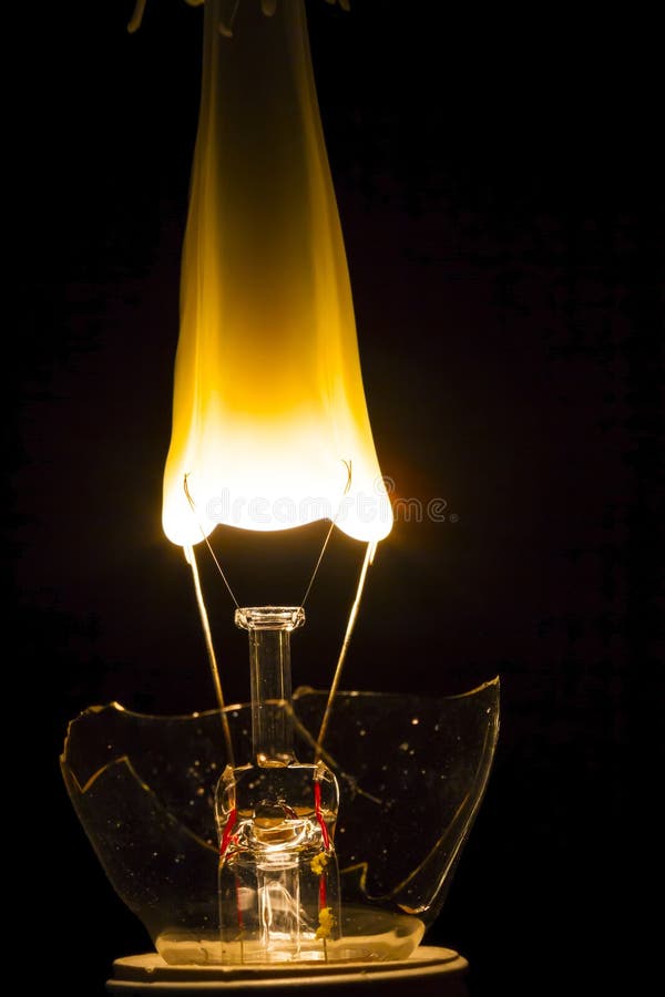 Broken Lightbulb with Filament Bursting into Flame Stock Photo - Image ...