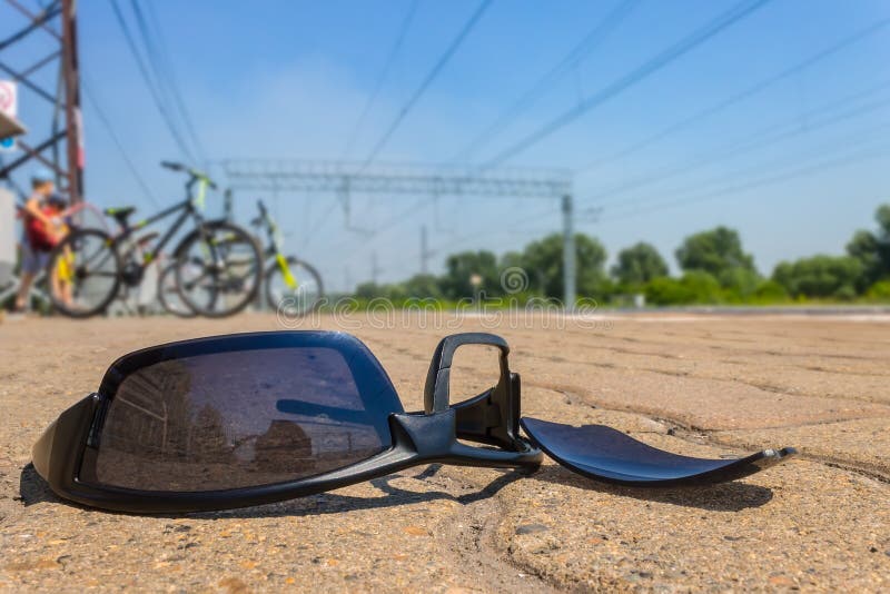Broken and Lost Black Glasses Lie on the Road Against the Backdrop of ...