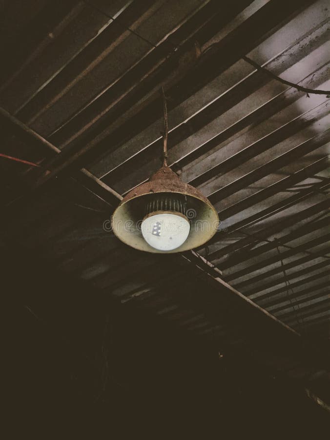 A Broken Low Light Dimming LED Light Bulb with Dirty Old Interior ...