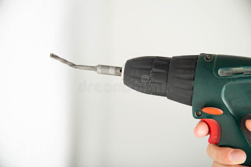 Broken Low-quality Drill in a Screwdriver on a White Background ...