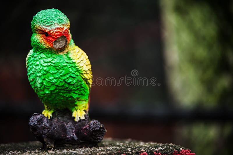 Broken Macaw Bird Statue stock image. Image of statue - 27700781