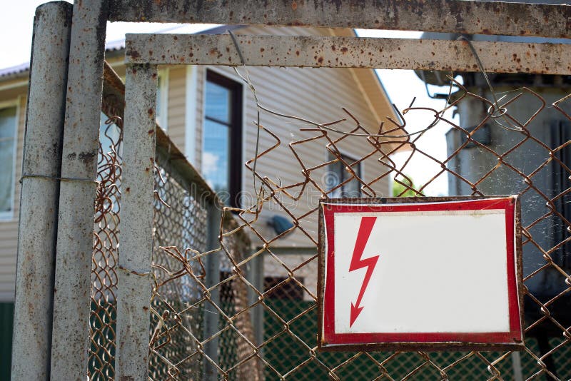 Broken Metal Fence with a Hazard Sign Stock Photo - Image of detail ...