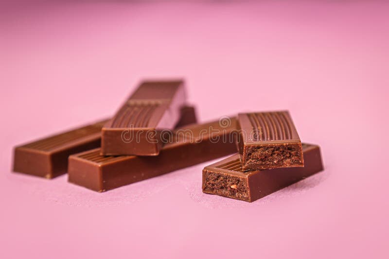 Broken Milk Chocolate on Pink Background Stock Image - Image of bitter ...