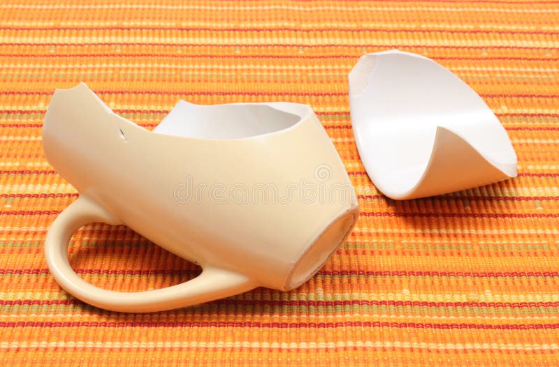 Broken Mug, Shattered Cup on Orange Cloth Stock Image - Image of broken ...