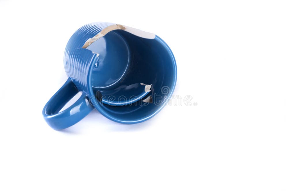 Broken Mug with Shattered Pieces Inside Laying Down Stock Photo - Image ...