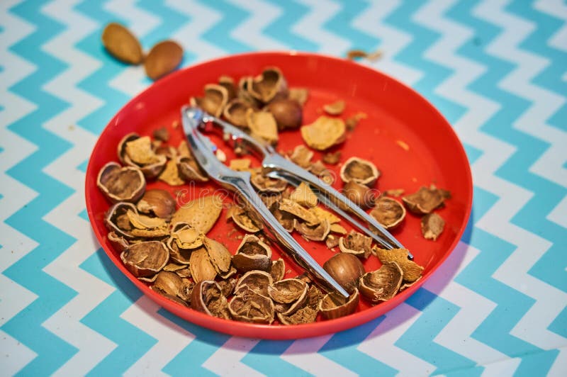 Broken nuts and cracker stock image. Image of table - 108407439