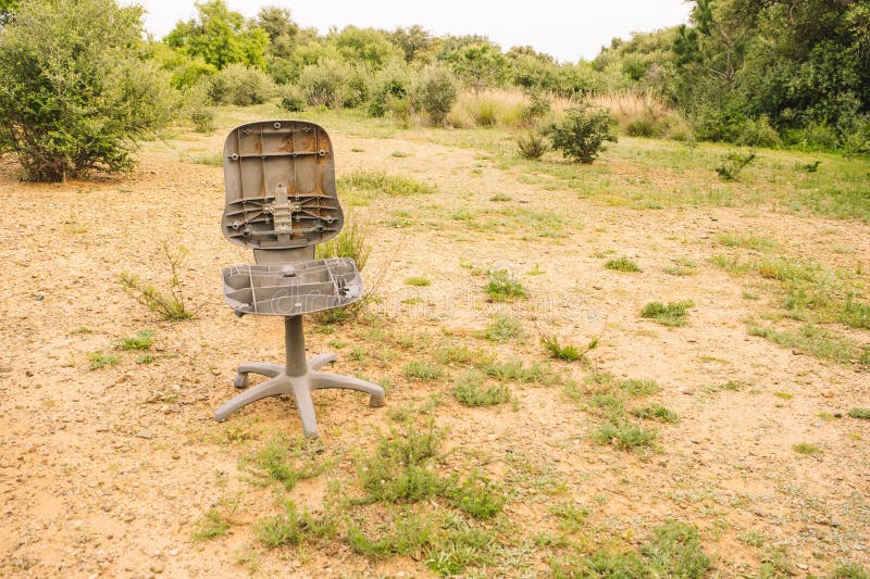 Broken Office Chair Lying in the Middle of the Forest Stock Photo ...