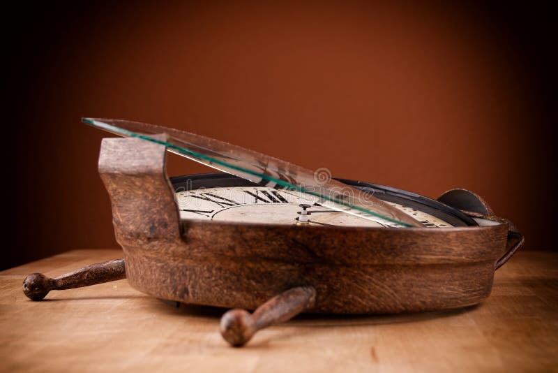 Broken Old Analog Clock with Glass and Metal Frame on Wooden Table ...