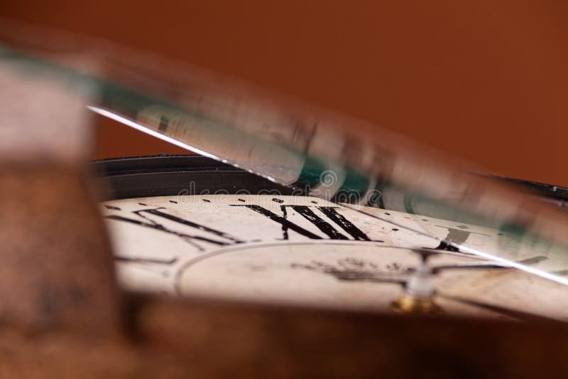 Broken Old Analog Clock with Glass and Metal Frame on Wooden Table ...