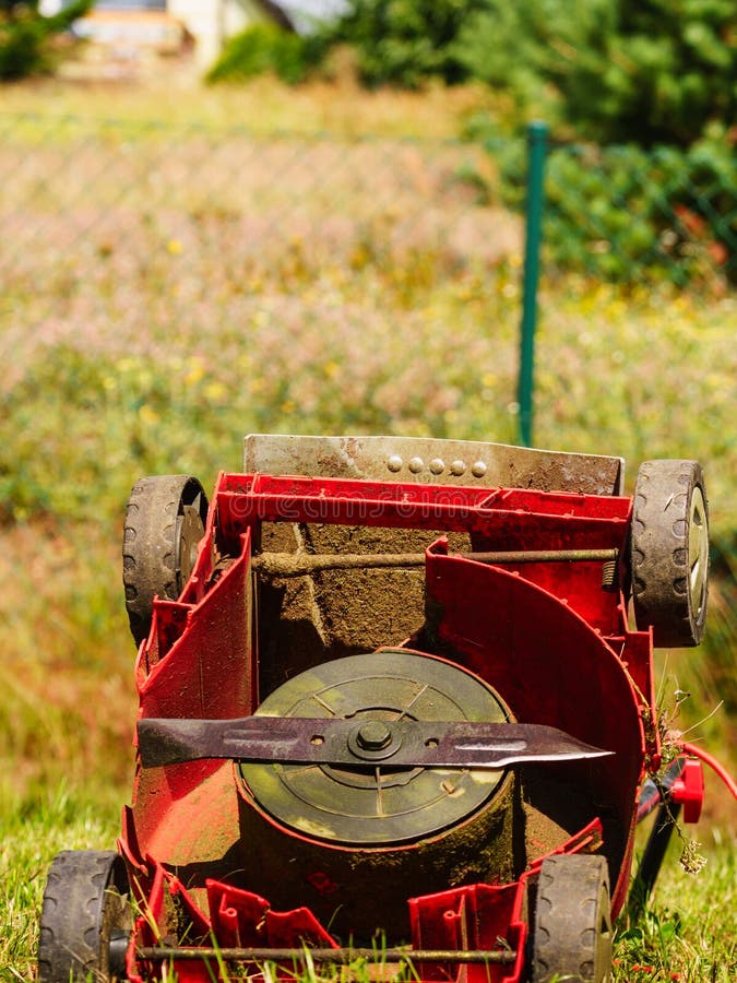 Broken Old Lawnmower in Backyard Grass Stock Image - Image of machine ...
