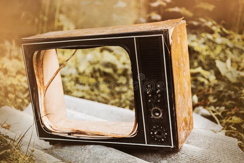 A Broken Old Retro TV with a Broken Screen is Lying in the Trash. the ...