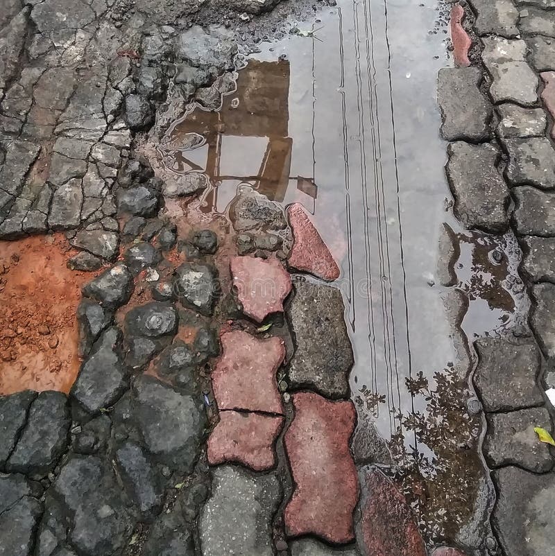 Broken paving roads stock image. Image of brick, leaf - 203971935