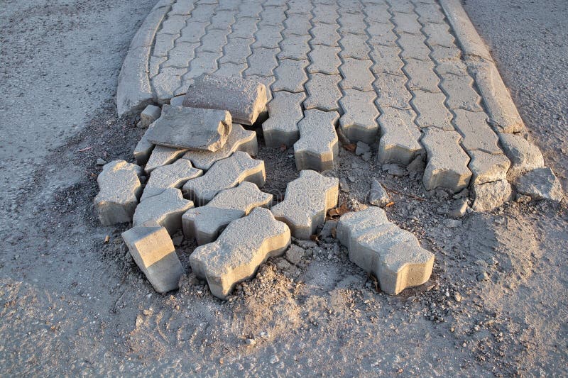 Broken Paving Stones on a Parking Lot Stock Photo - Image of ...